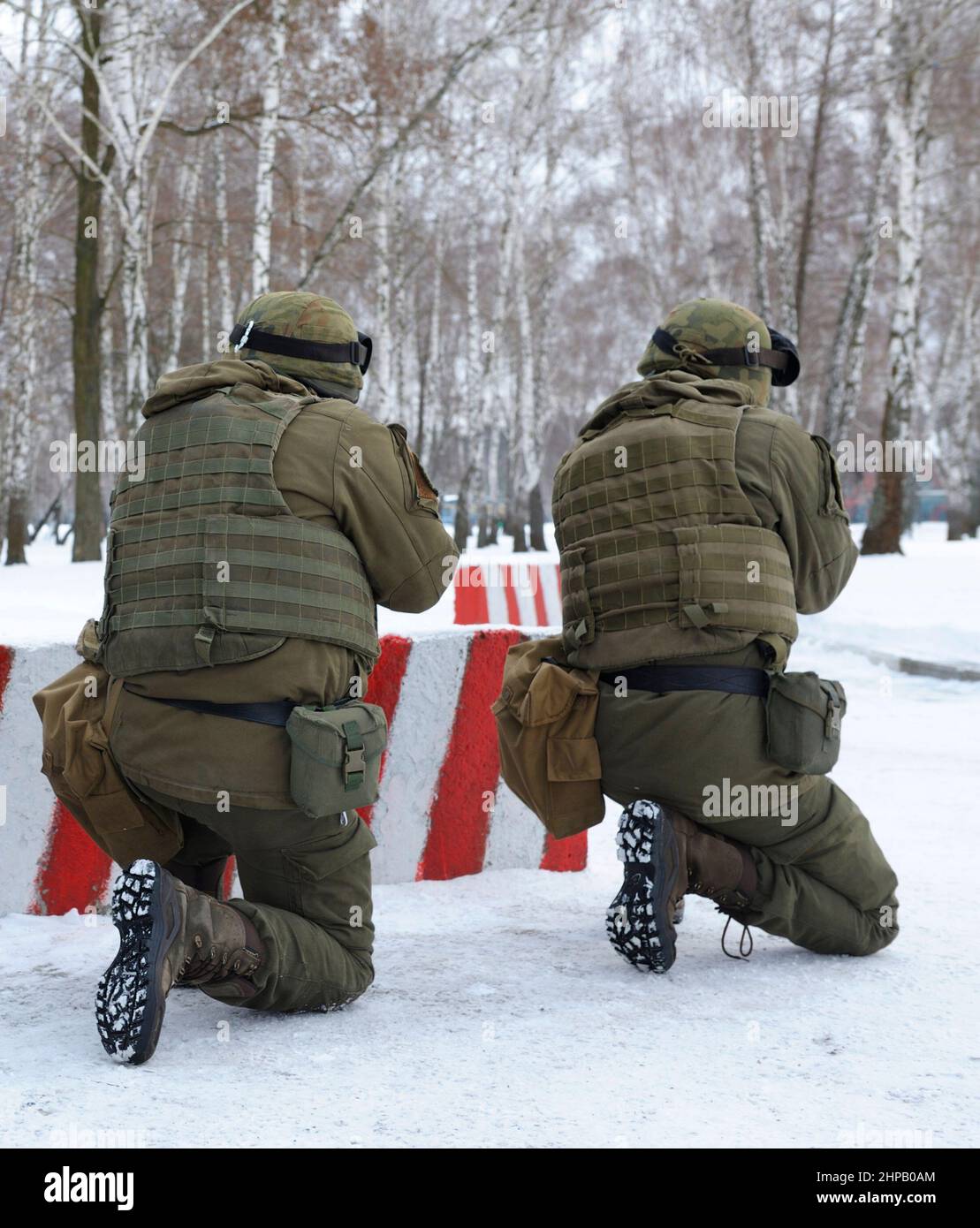 Soldiers taking position guarding roadblock. Military range, Ukraine ...