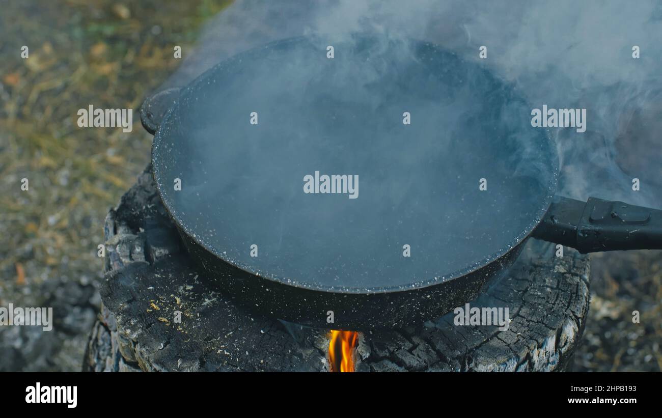 Swedish or finnish log candle. Fire burning from inside the wooden log ...