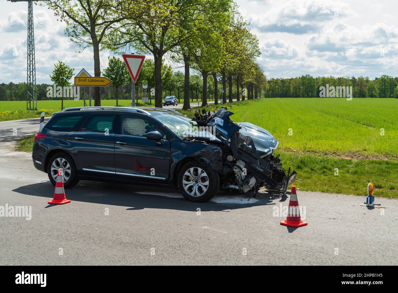 A heavily damaged car with front end damage Stock Photo - Alamy