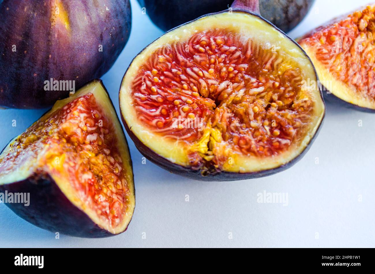 slices of fresh figs on white background Stock Photo - Alamy