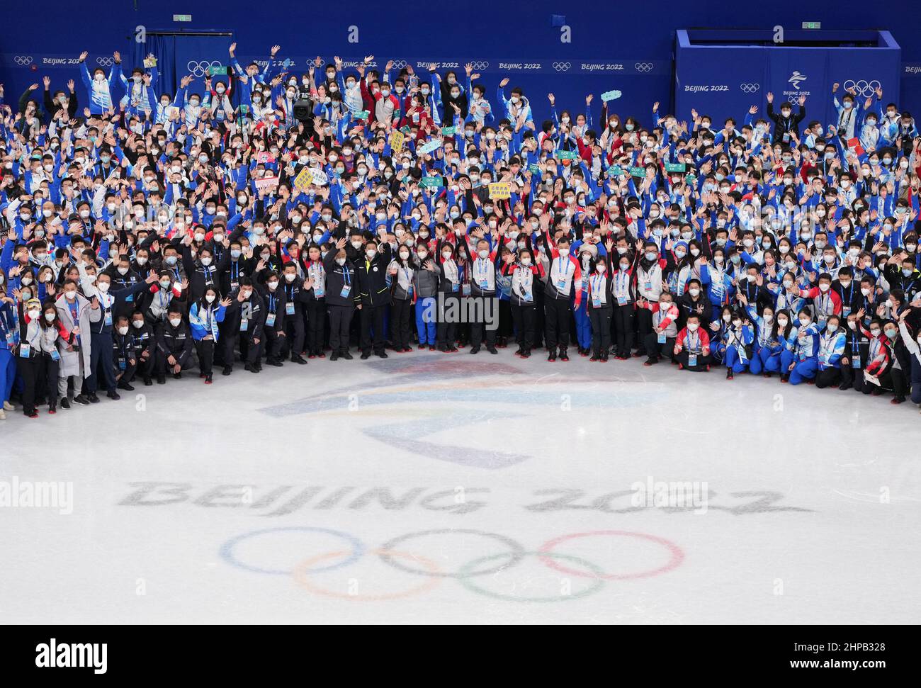 Beijing, China. 20th Feb, 2022. Volunteers pose for group photo after ...