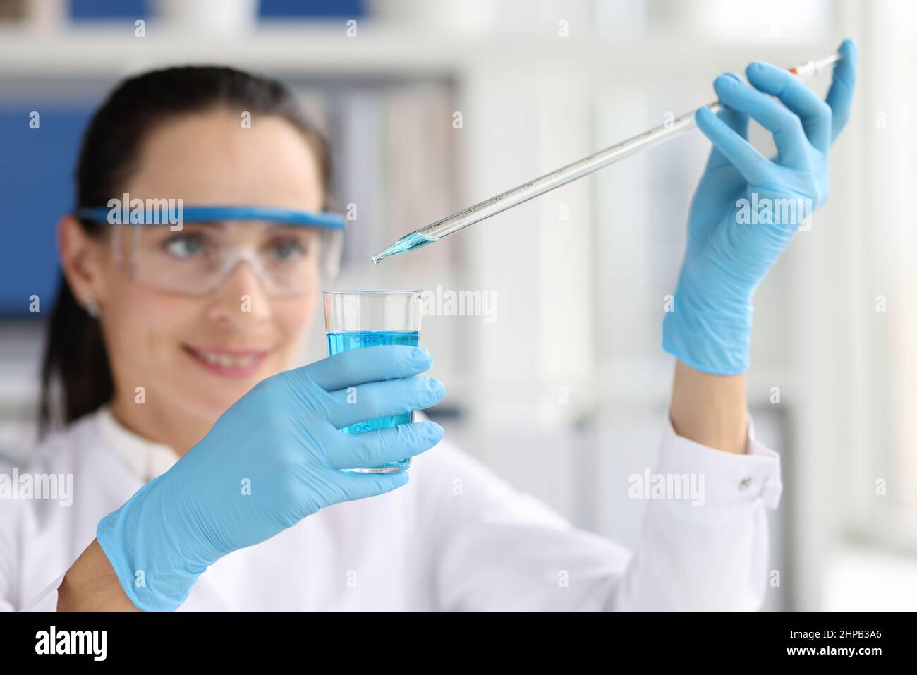 Pipette in test tube blue hi-res stock photography and images - Alamy