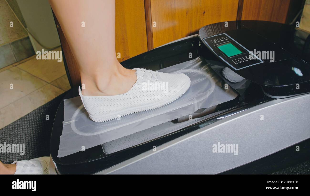 Automatic Thermal Shrinkable Shoe Cover Laminating Machine. Close up ...