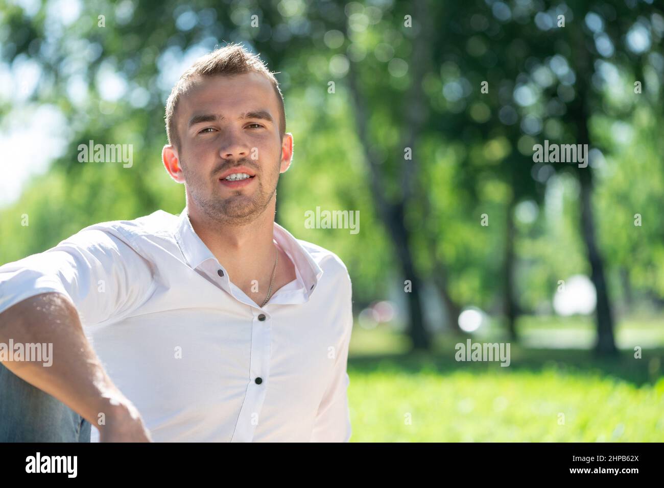 Young man in the park Stock Photo - Alamy