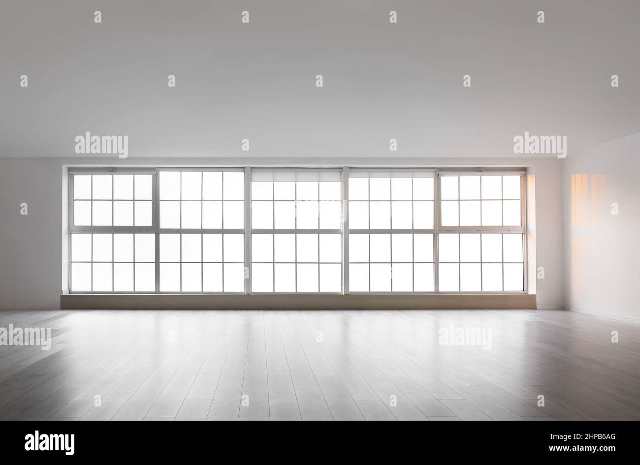 View of empty room with windows Stock Photo - Alamy