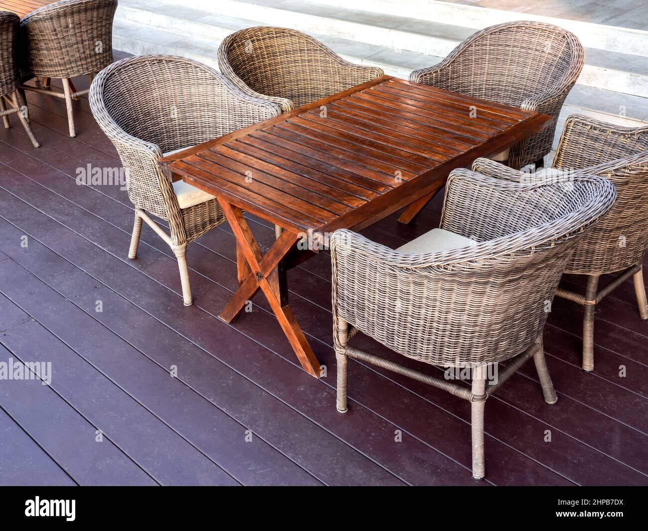 Empty rattan furniture, outdoor garden weave table set with wooden ...
