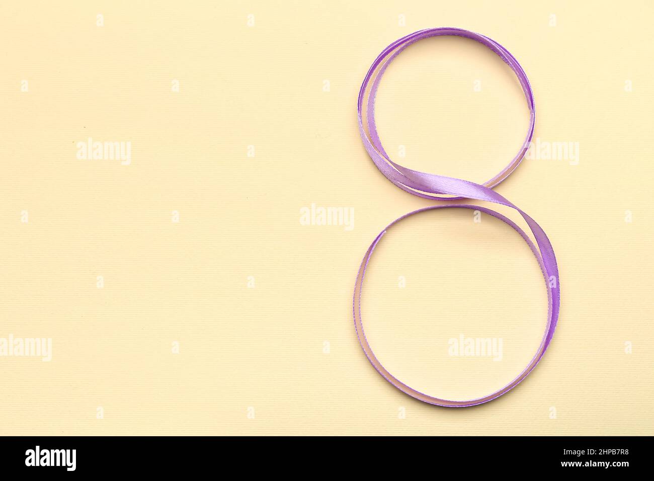 Figure 8 made of lilac ribbon for International Women's Day celebration ...