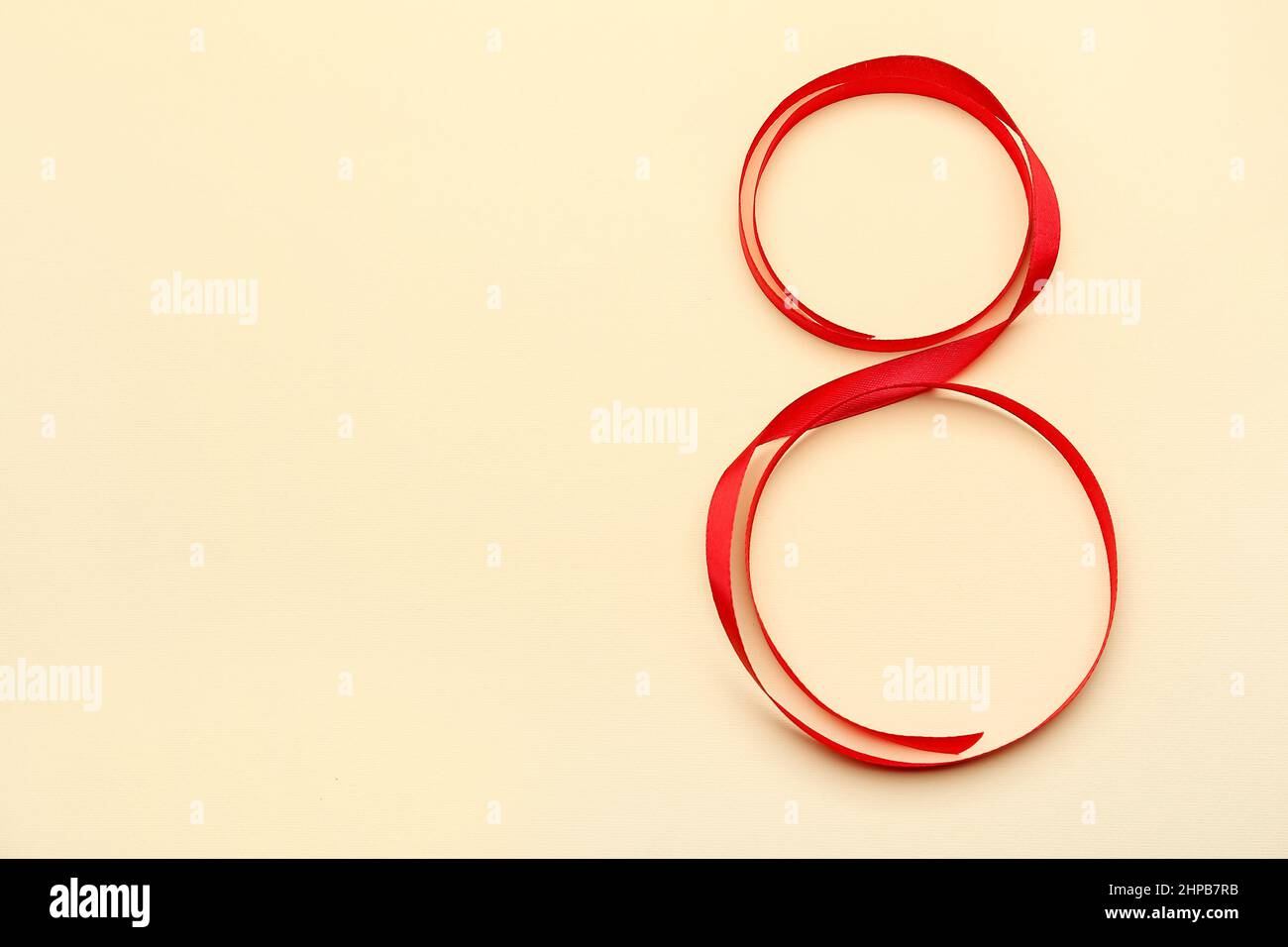 Figure 8 made of red ribbon for International Women's Day celebration ...