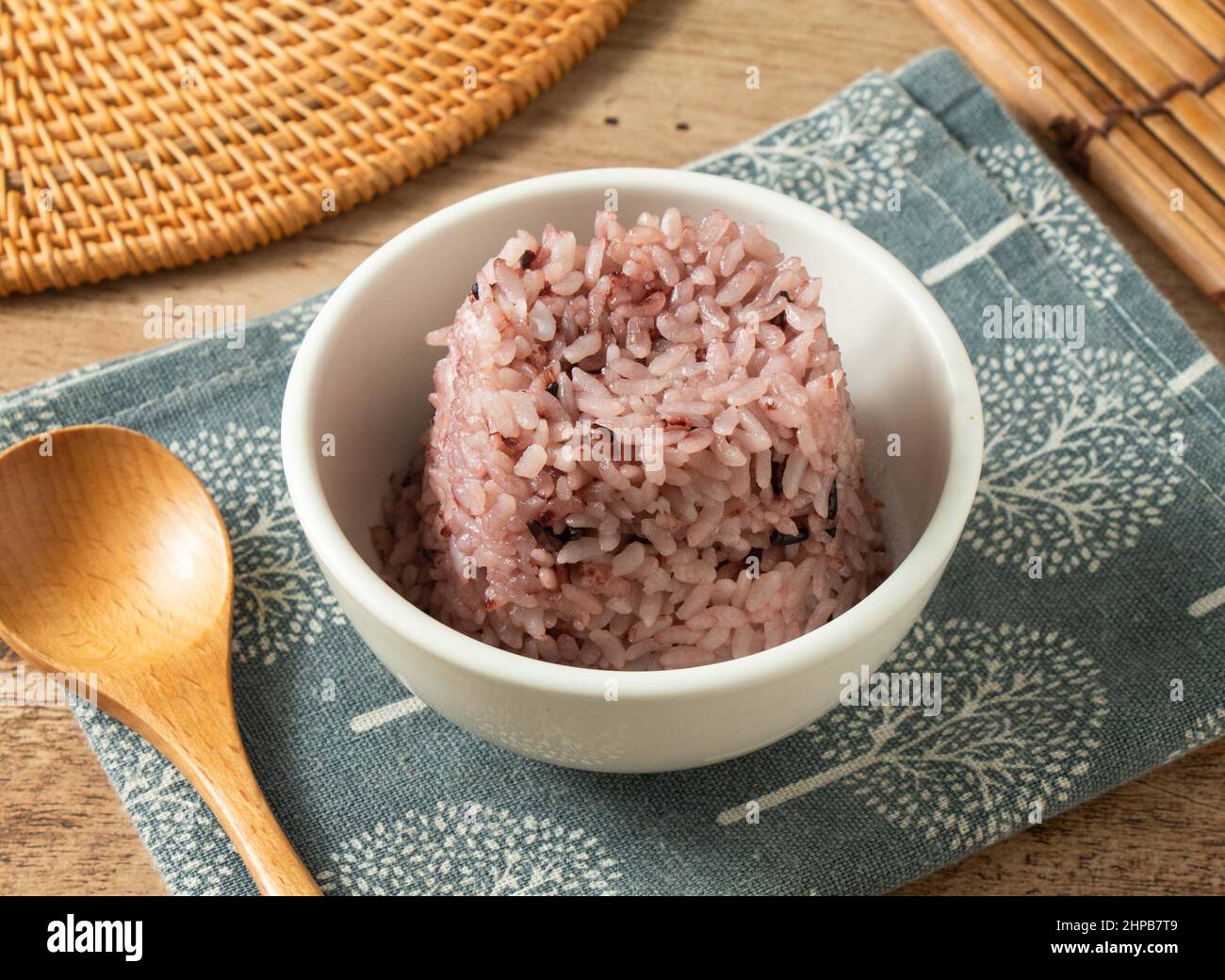 Poor Charlie's Plain Purple Rice in a white bowl with wooden spoon ...