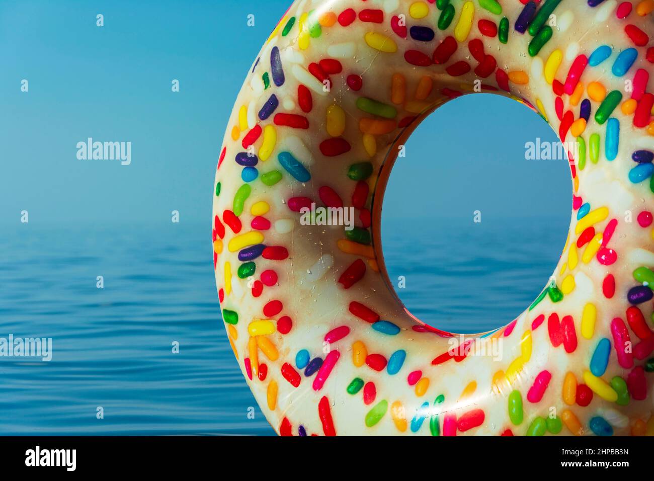 Colorful bright inflatable swimming circle on the background of the ...