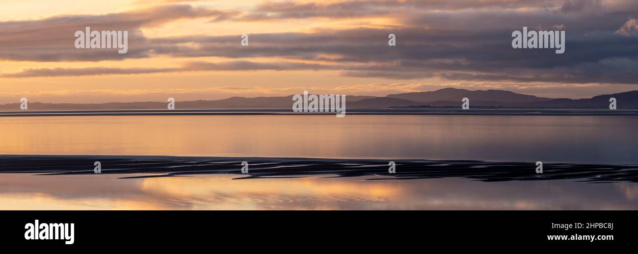 Epic sunset landscape image of Solway Firth viewed from Silloth during ...