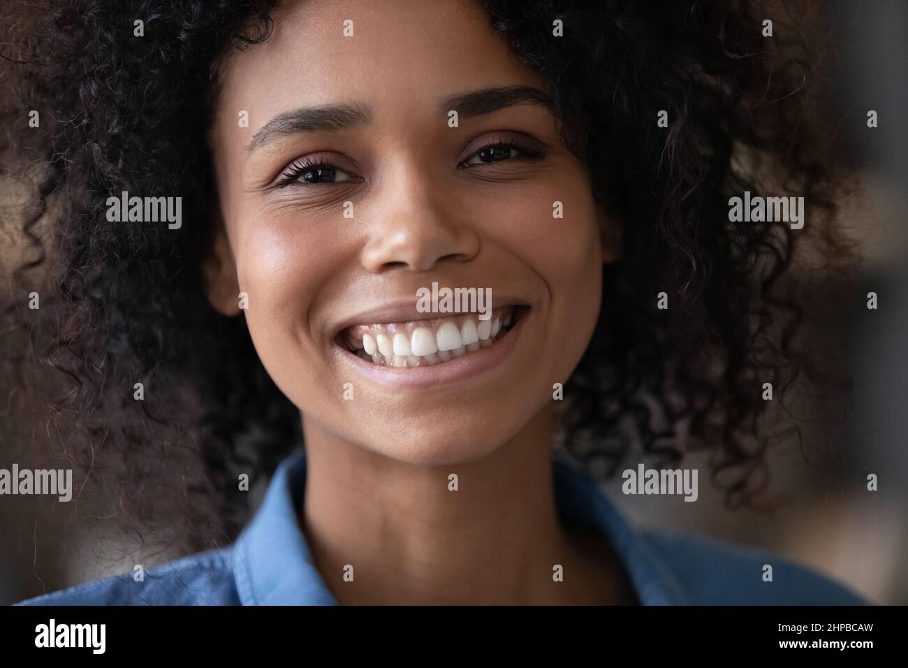 Happy young African American woman showing perfect smile Stock Photo ...