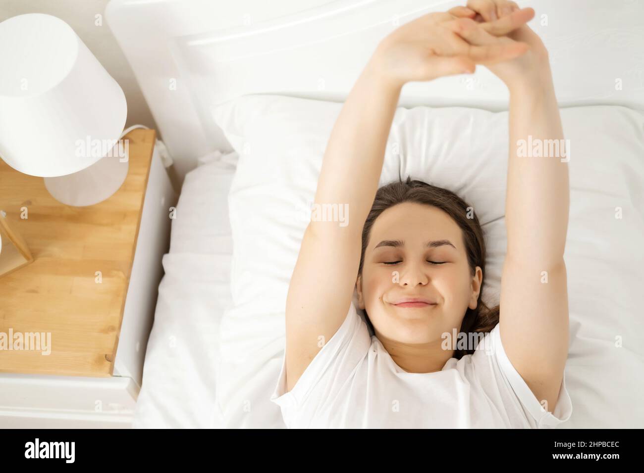 African girl waking up in bed hi-res stock photography and images - Alamy