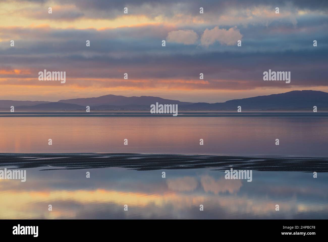 Epic sunset landscape image of Solway Firth viewed from Silloth during ...
