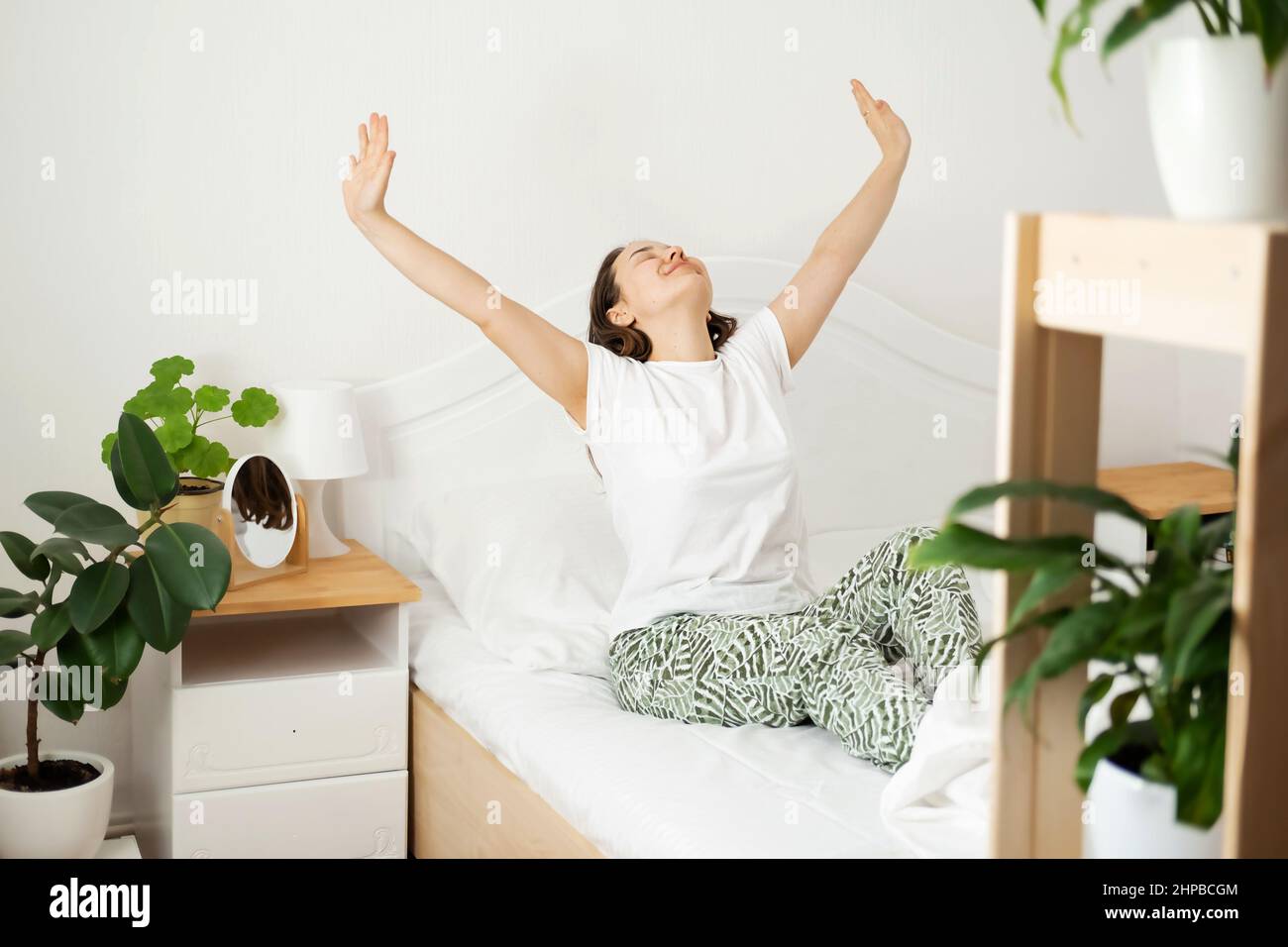 African girl waking up in bed hi-res stock photography and images - Alamy