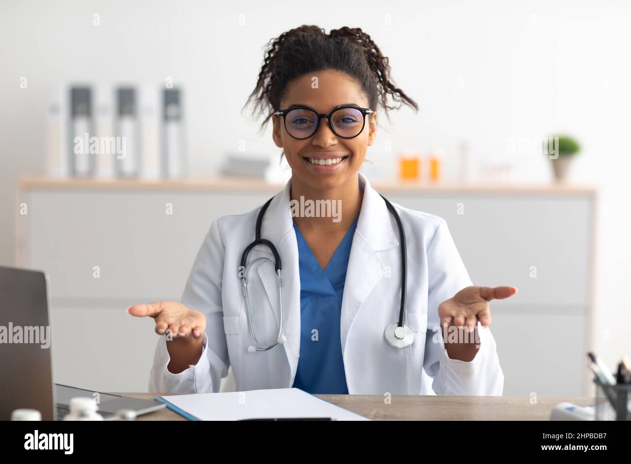 Portrait of black female medical practitioner talking to camera Stock ...