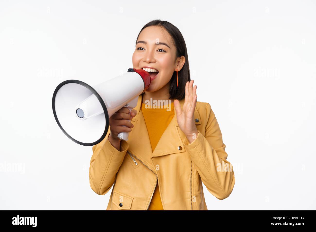 Attention announcement. Image of asian woman shouting in megaphone ...
