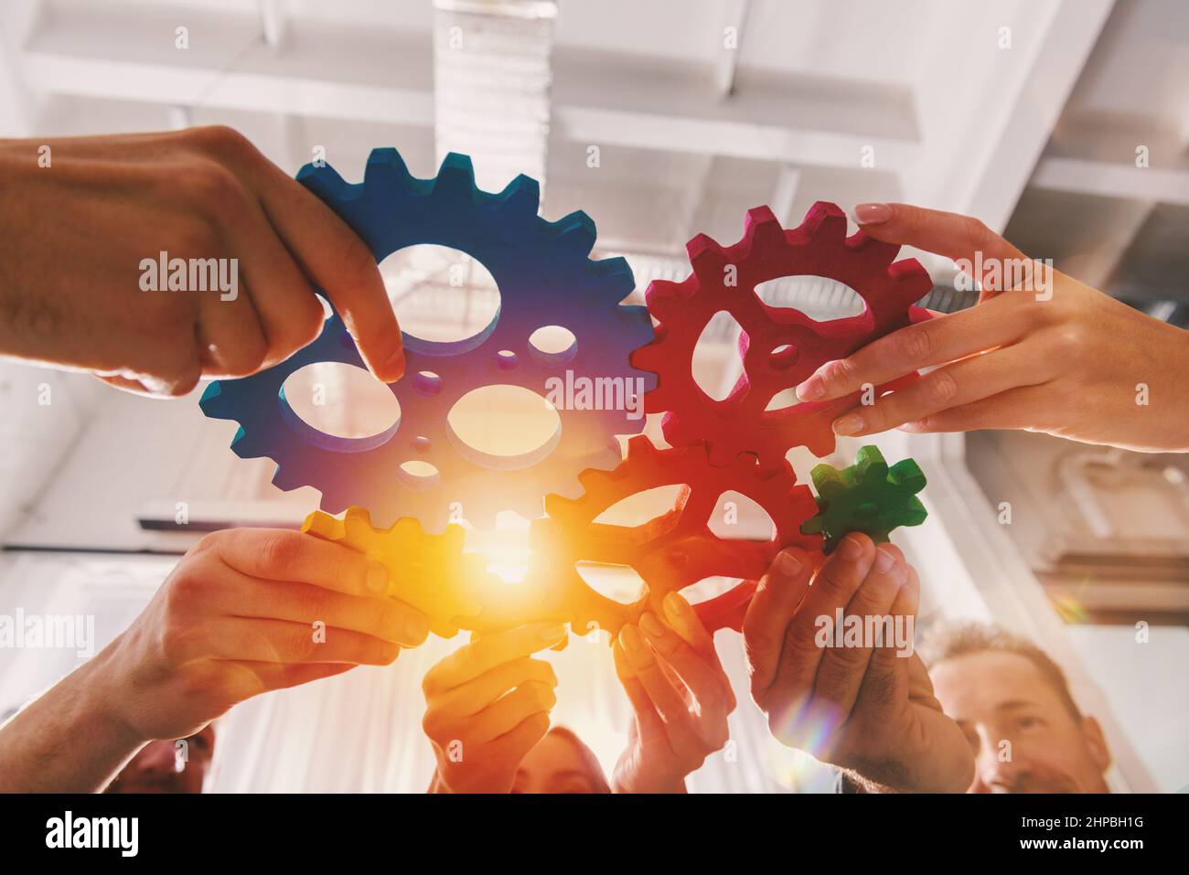 Business team connect pieces of gears like a teamwork and partners ...
