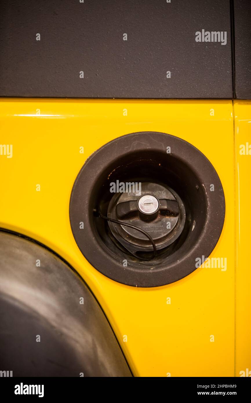 Fuel tank lid of a yellow car Stock Photo - Alamy