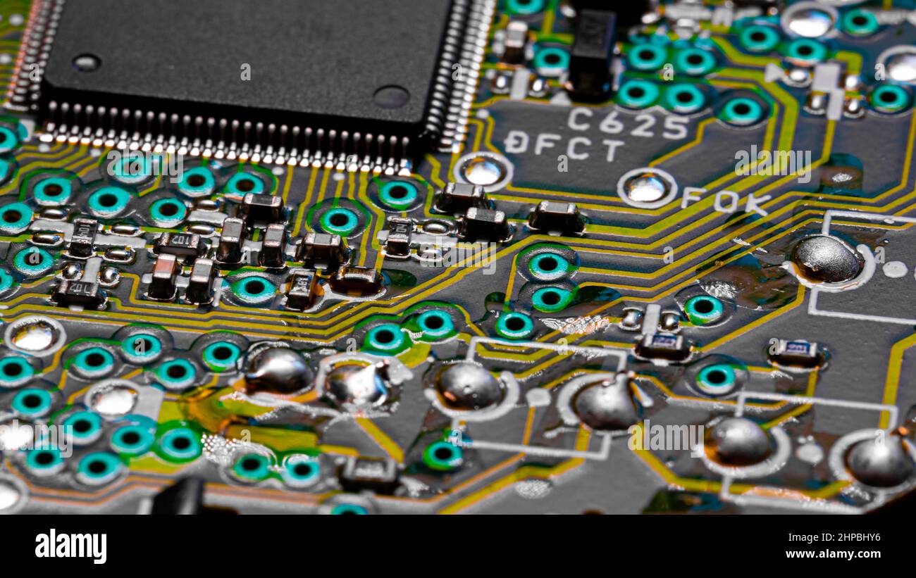 Macro Close up of printed wiring and components on PC circuit board ...