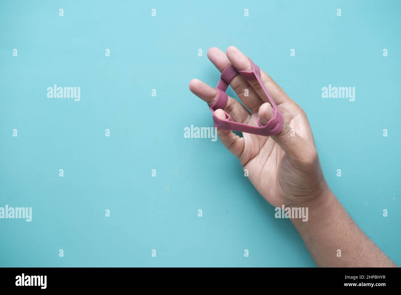 Hand and Finger Strengthening Exercises on light green Background Stock ...