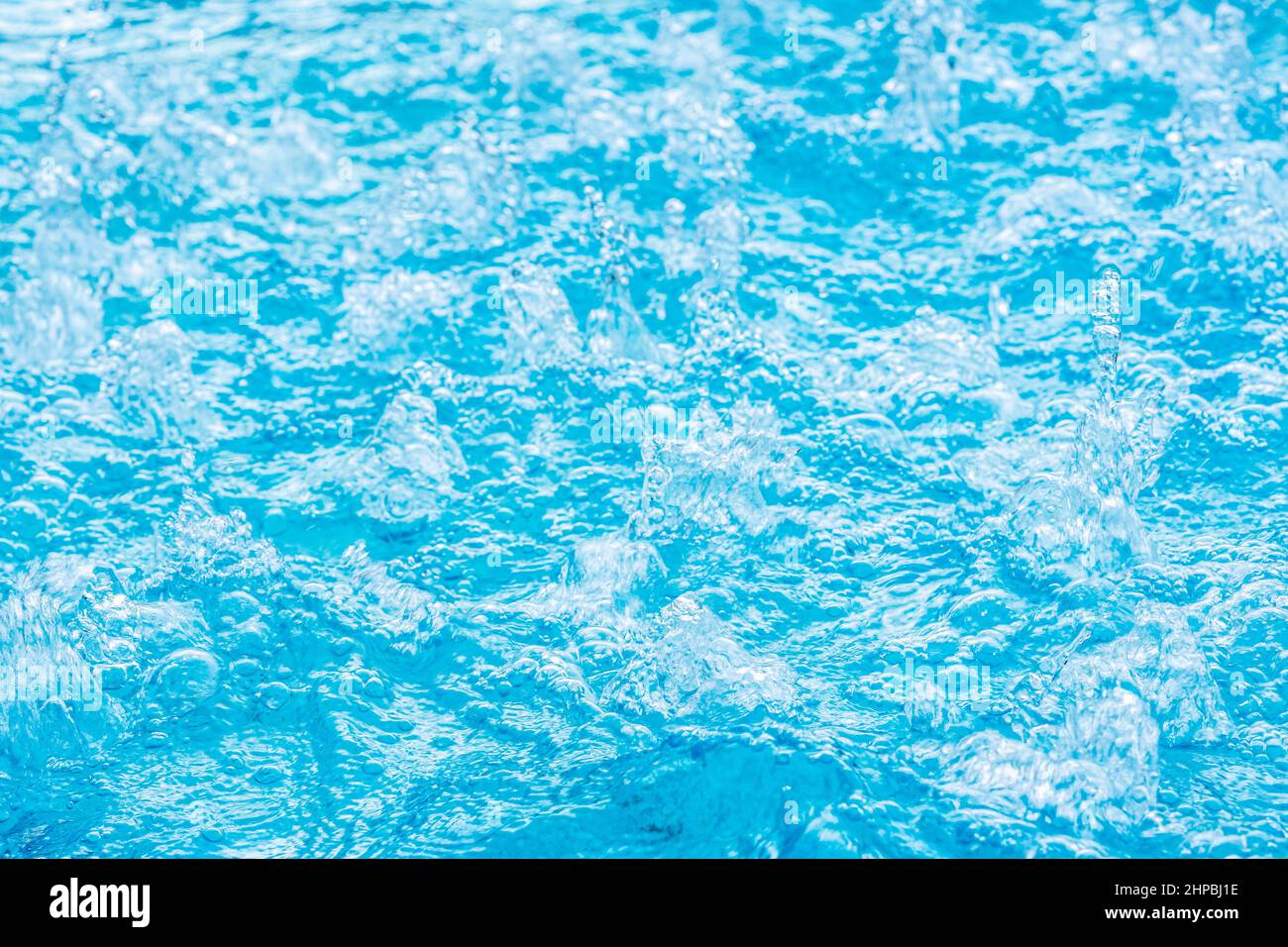 hydro massage background, bubbling blue water bubbles on turquoise aqua ...
