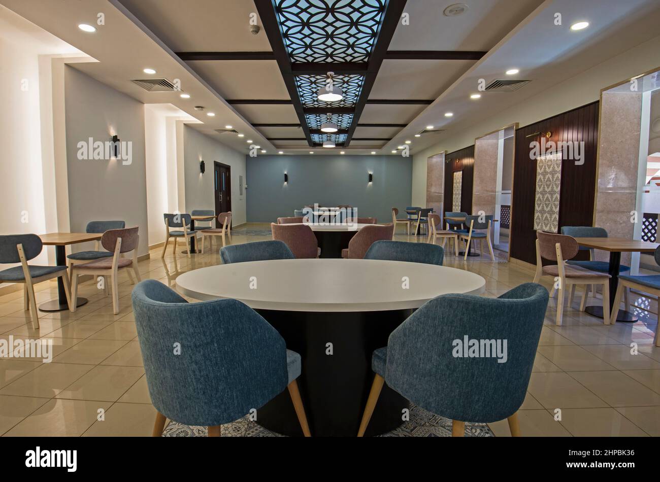 Interior design of a luxury hotel restaurant dining area with tables ...