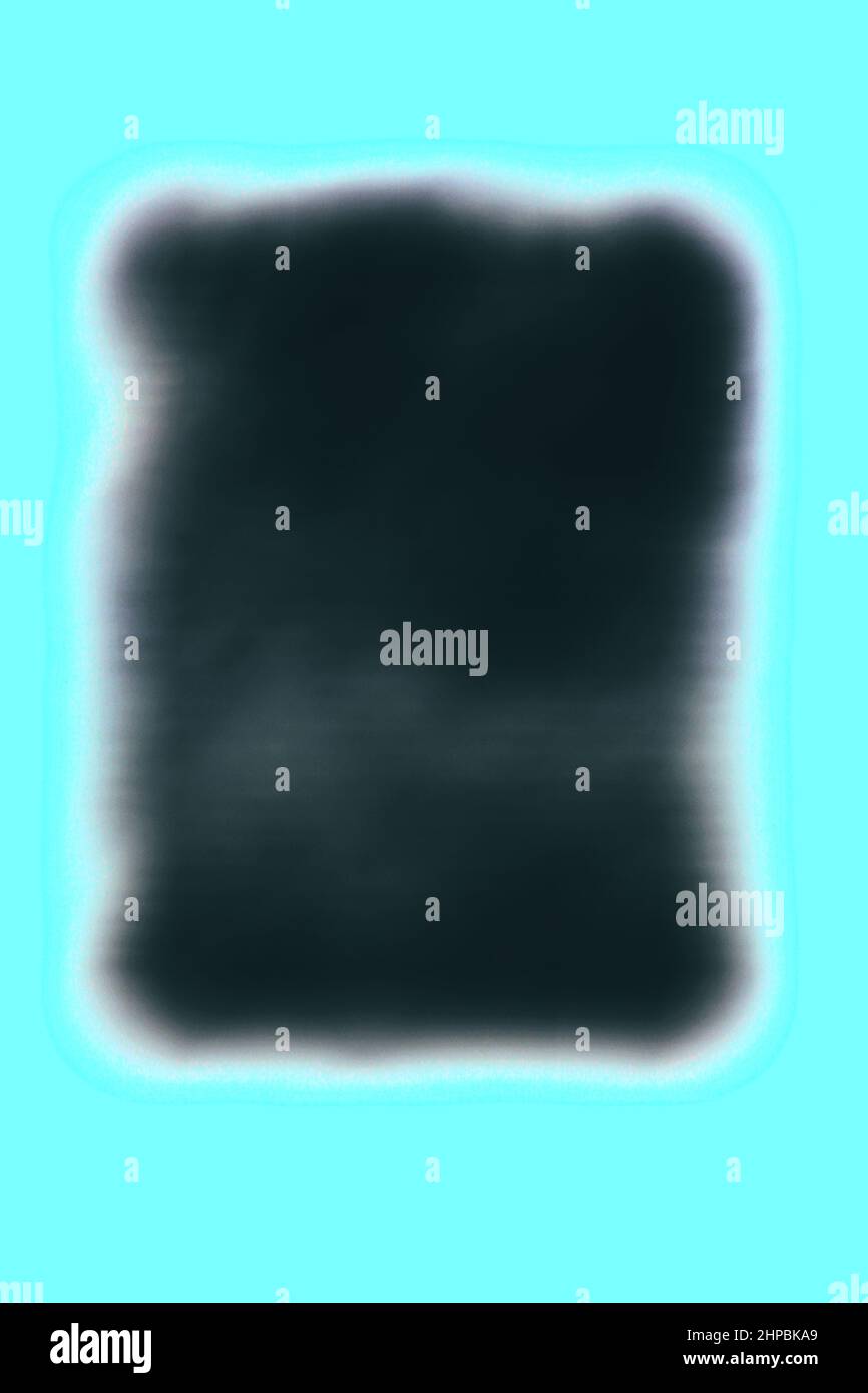 Dreamy blurry view of a black rectangle on a blue green background with ...