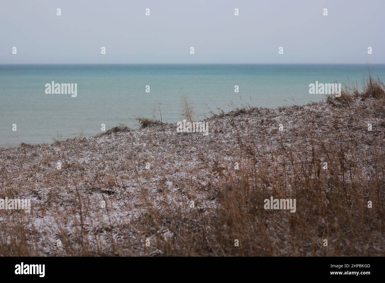 Starck and barren winter cliff overhanging Lake Michigan in Wisconsin ...