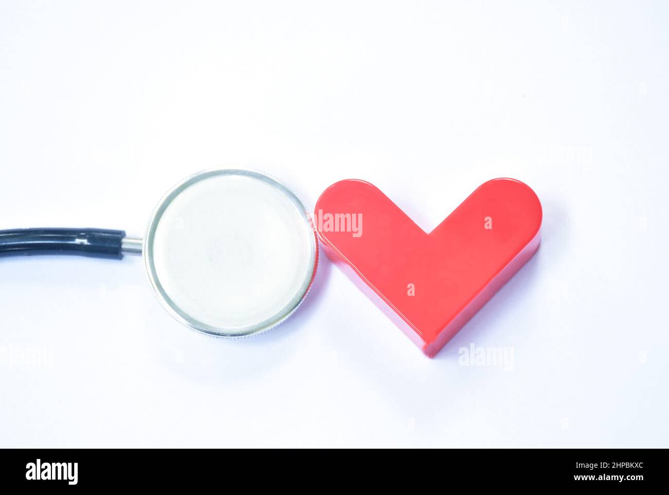 red heart and stethoscope medical equipment for doctor listening pulse ...