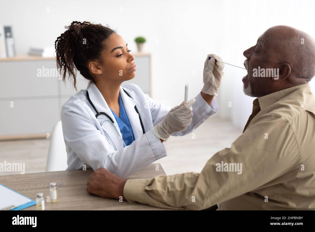 Coronavirus Diagnostic And Testing. Black Medical Worker Making Oral ...