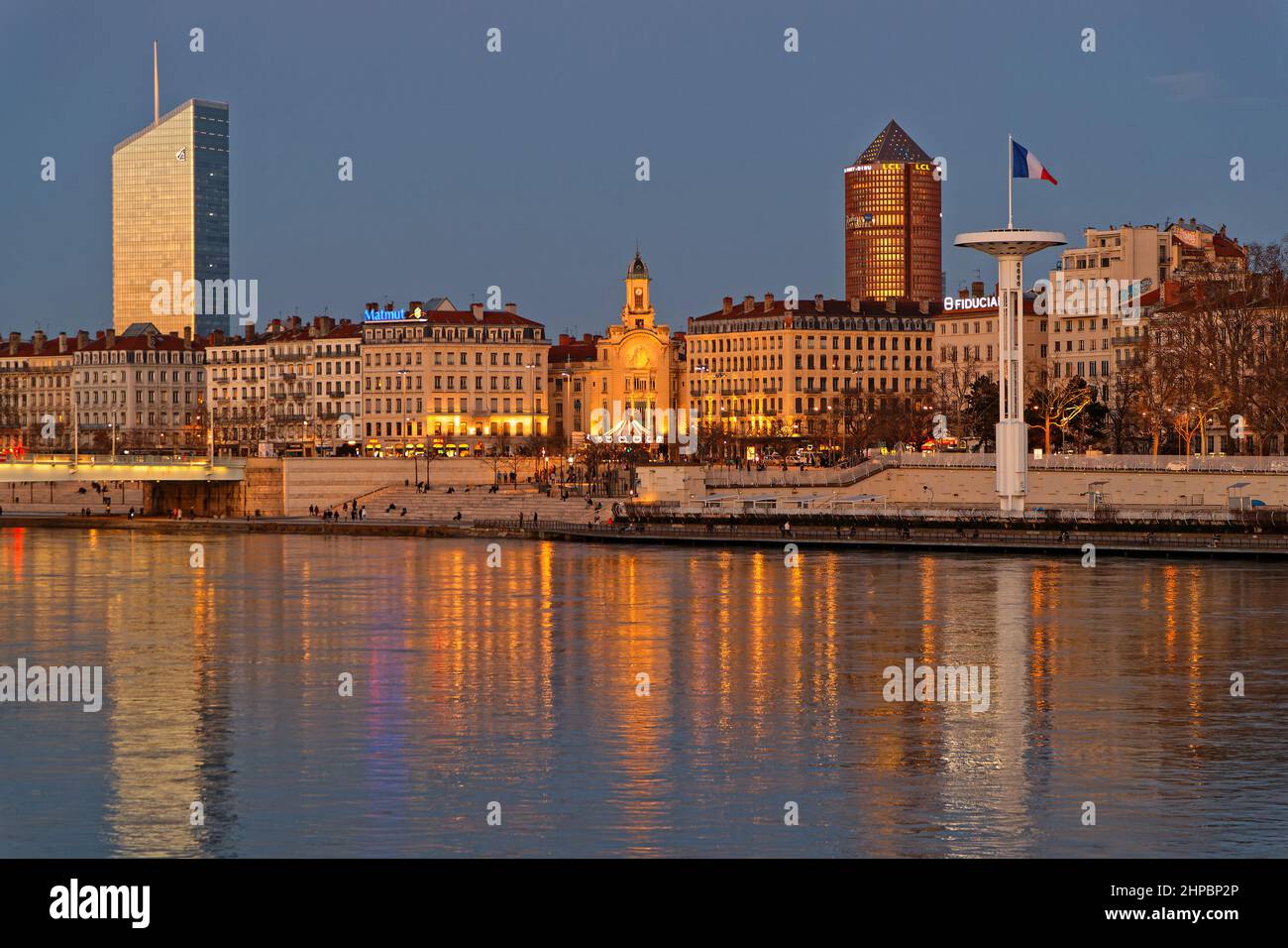 LYON, FRANCE, February 19, 2022 : The Rhone river quays at the blue ...