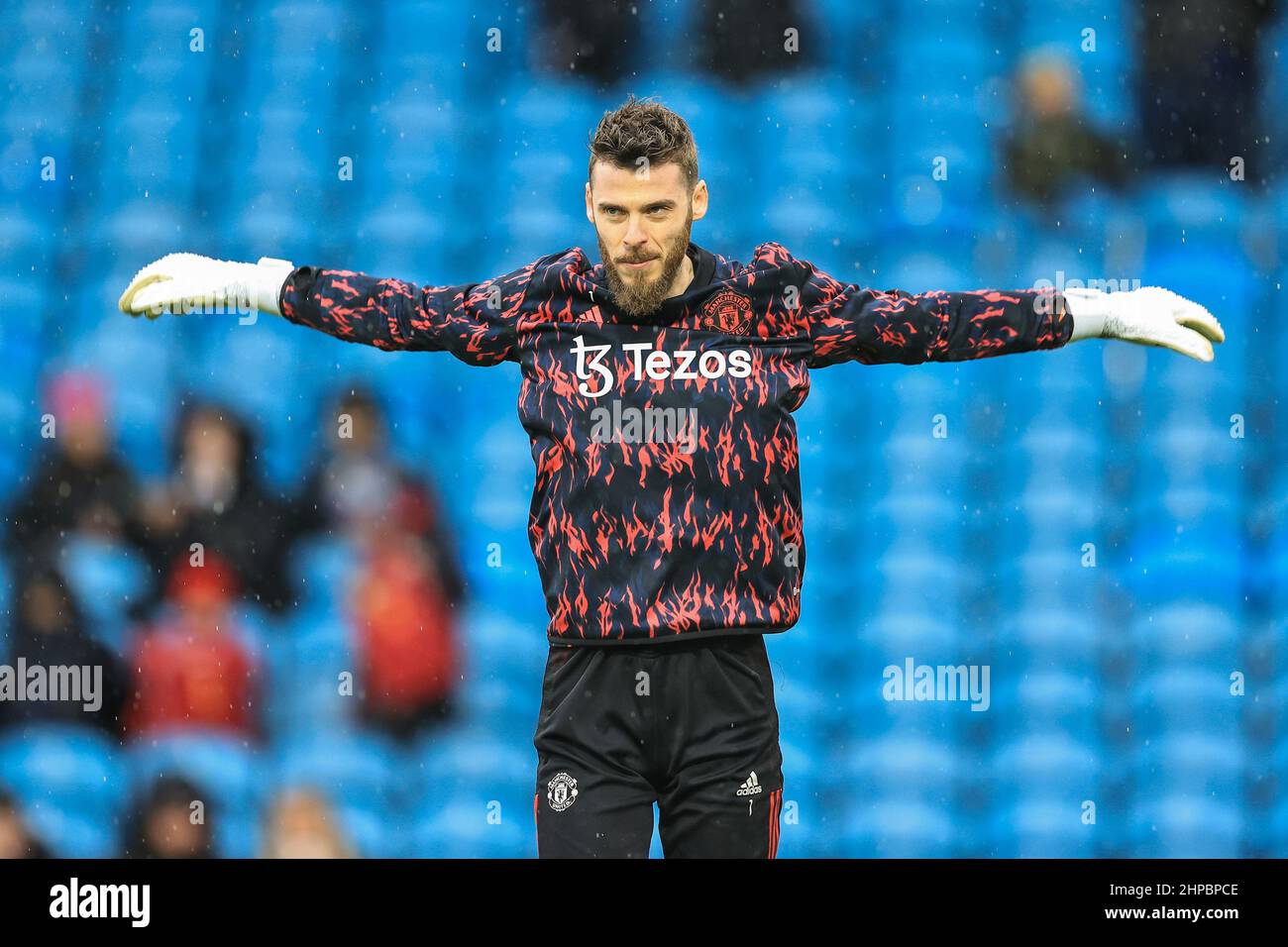 David De Gea #1 of Manchester United stretches during the pre-game ...