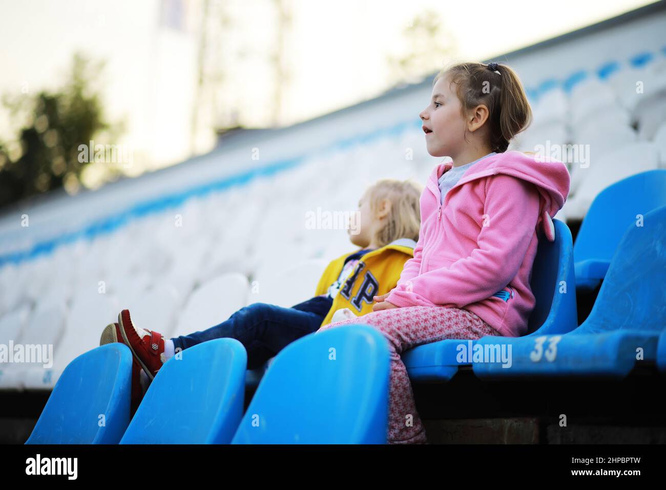 Plastic chairs in the stands of a sports stadium. Cheer on the stands ...