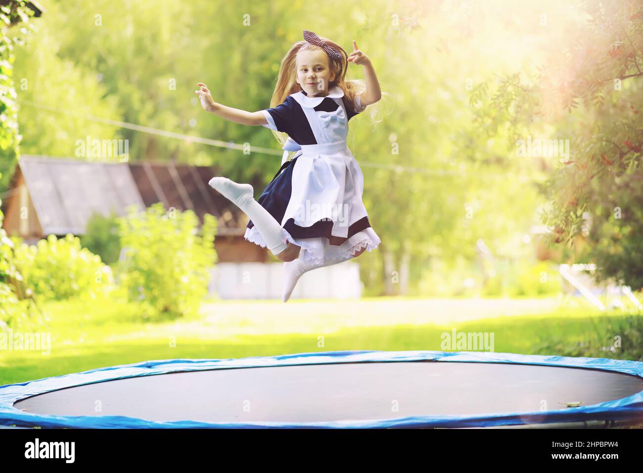 Children in school uniforms walk on the street. Children rejoice and ...