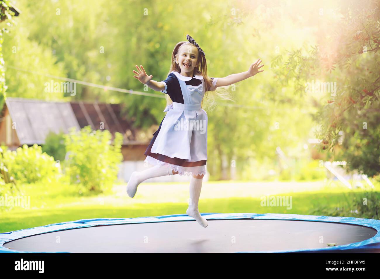 Children in school uniforms walk on the street. Children rejoice and ...