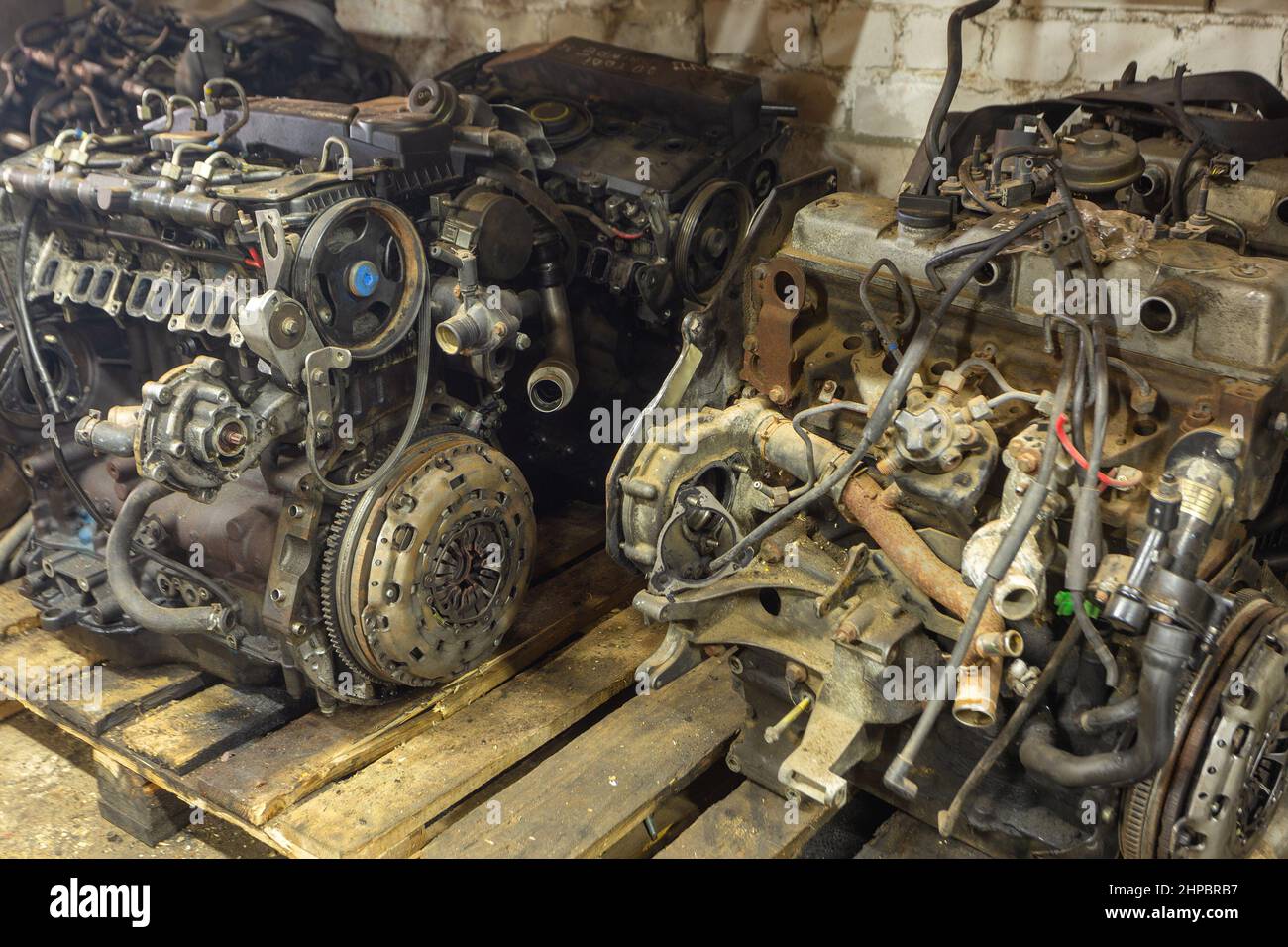 Pallets with used engines in the warehouse of an organization engaged ...