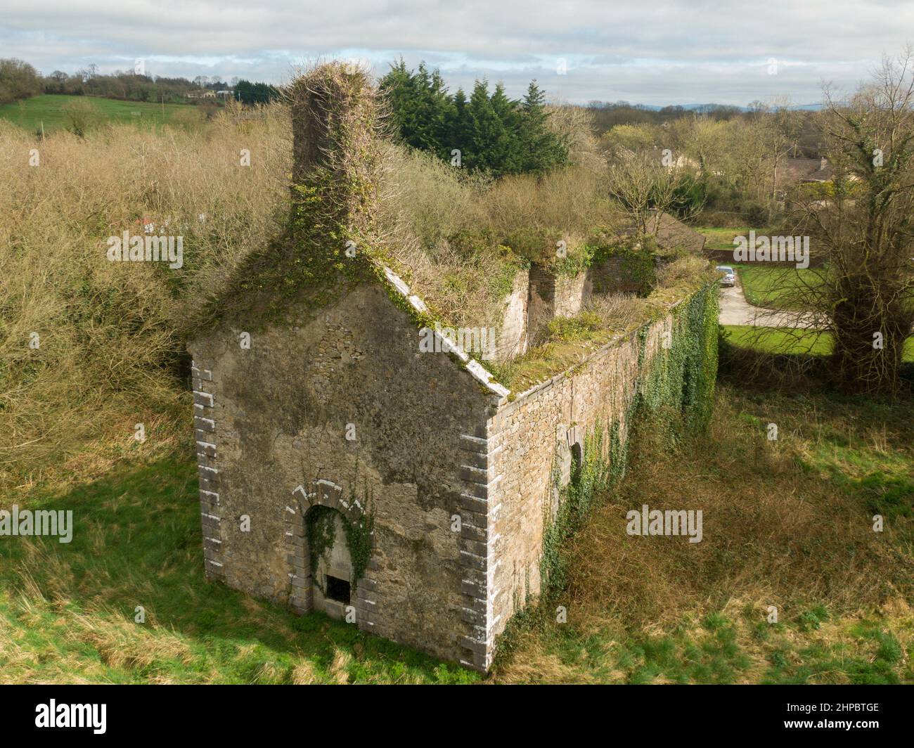 Old ruins of a small village church on the outskirts along with a ...