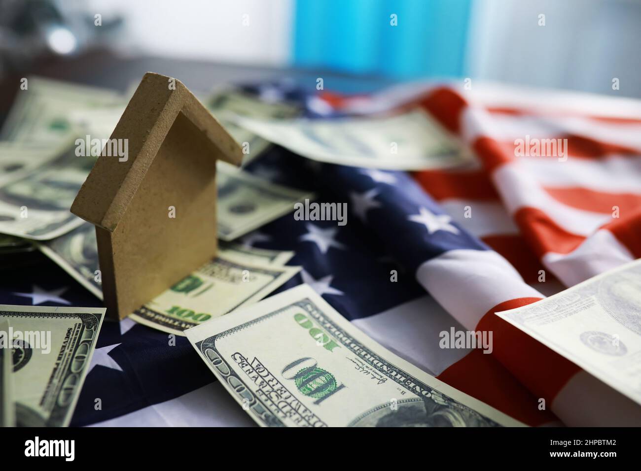 House symbol on American flag. Mortgage credit lending. Housing safety ...
