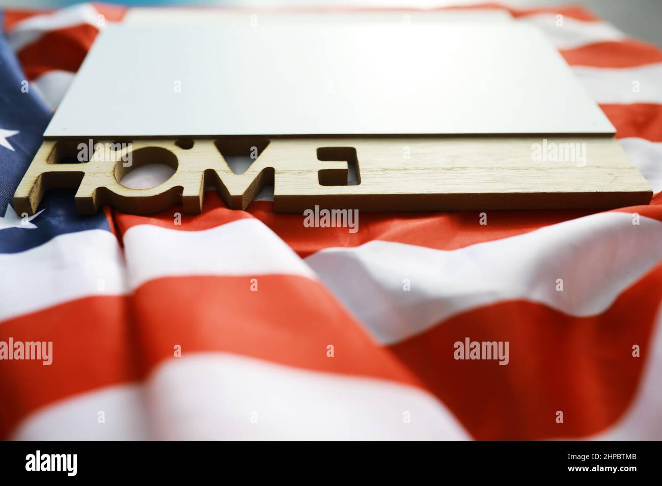 House symbol on American flag. Mortgage credit lending. Housing safety ...