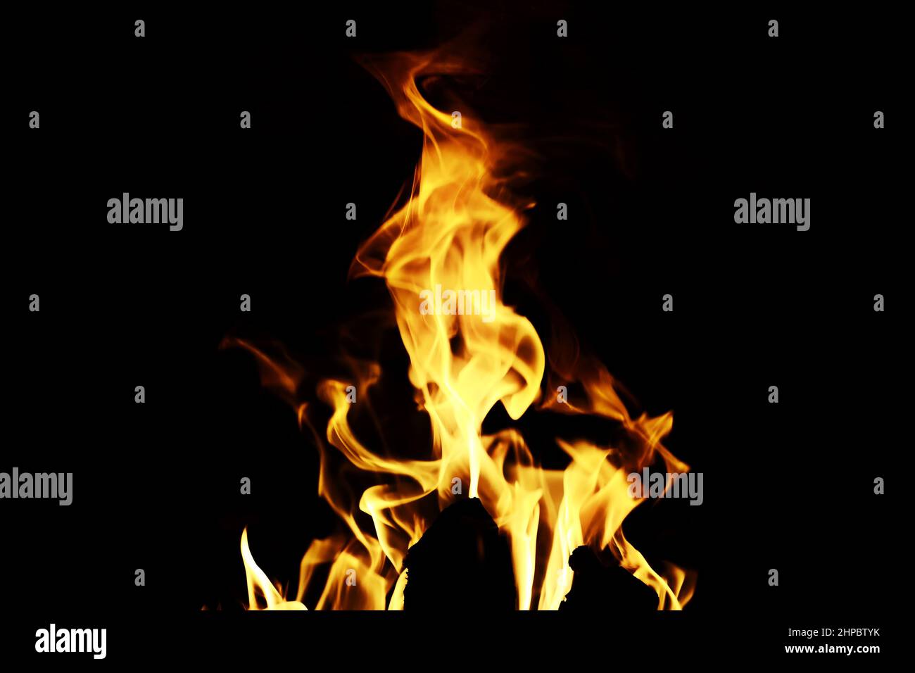 Background of the flame in the oven. Tongues of fire in brick fireplace ...