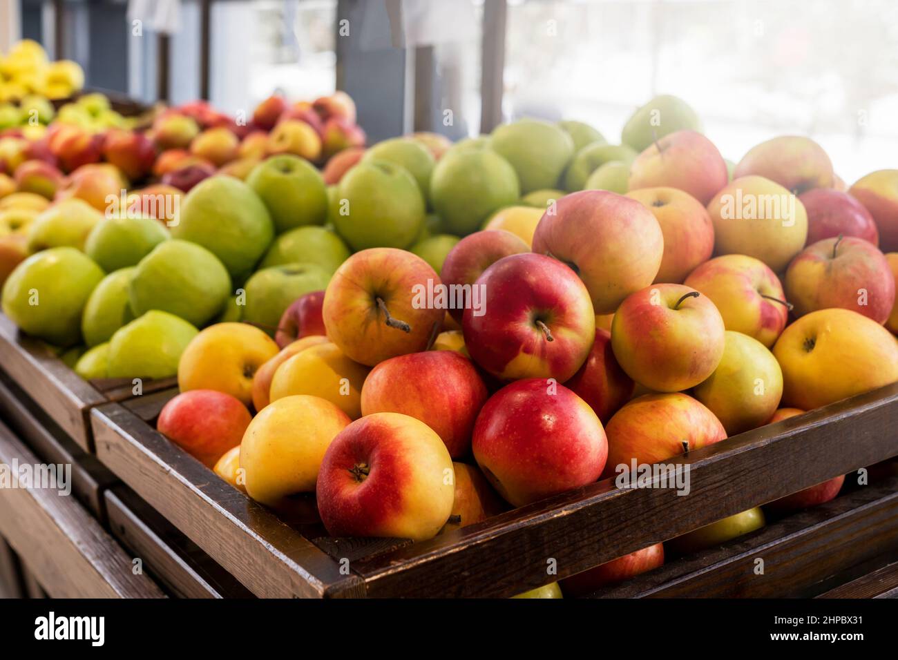 Fresh apples in the store on the counter showcase trade. fresh fruits ...