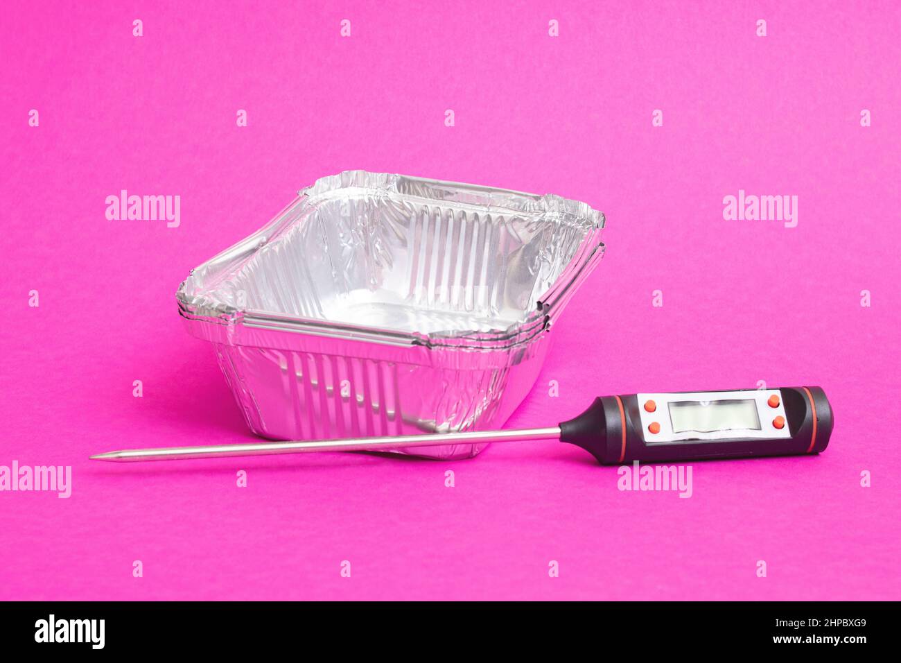 Thermometer for measuring the temperature of food and baking dish Stock ...