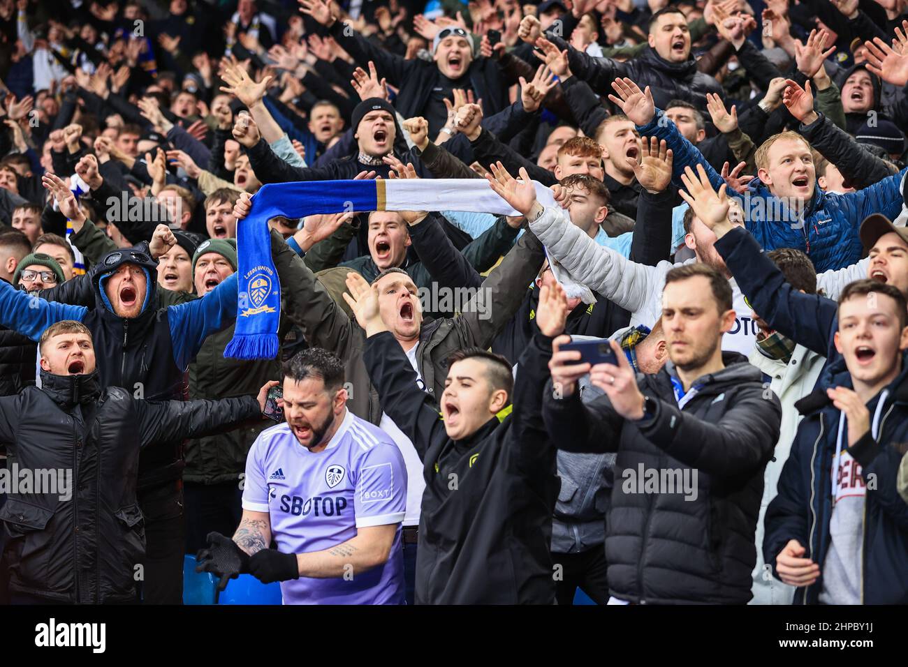 Leeds United fans sing during the game Stock Photo - Alamy
