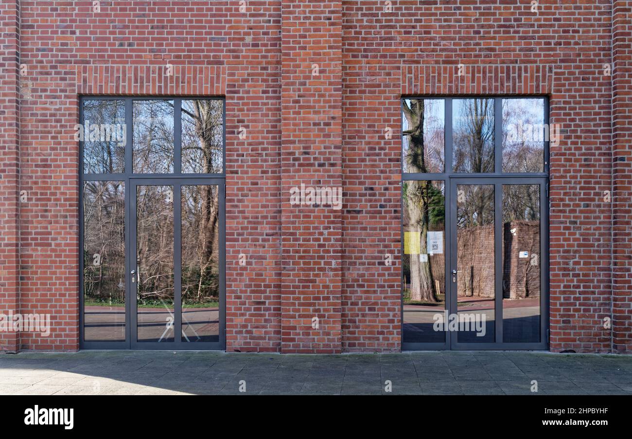 Red brickwork with two windows Stock Photo - Alamy