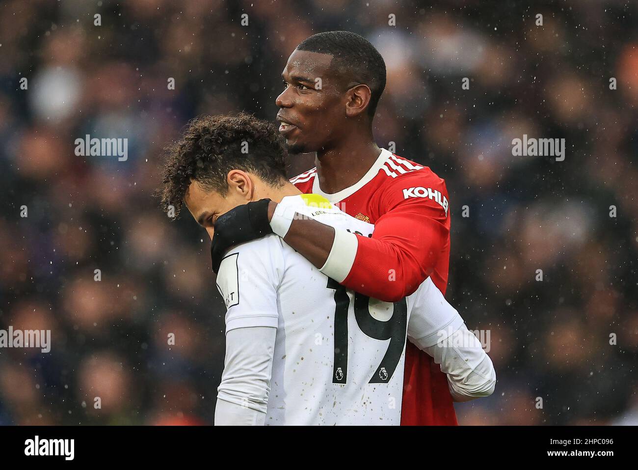 Paul Pogba #6 of Manchester United puts his arm around Rodrigo Moreno ...