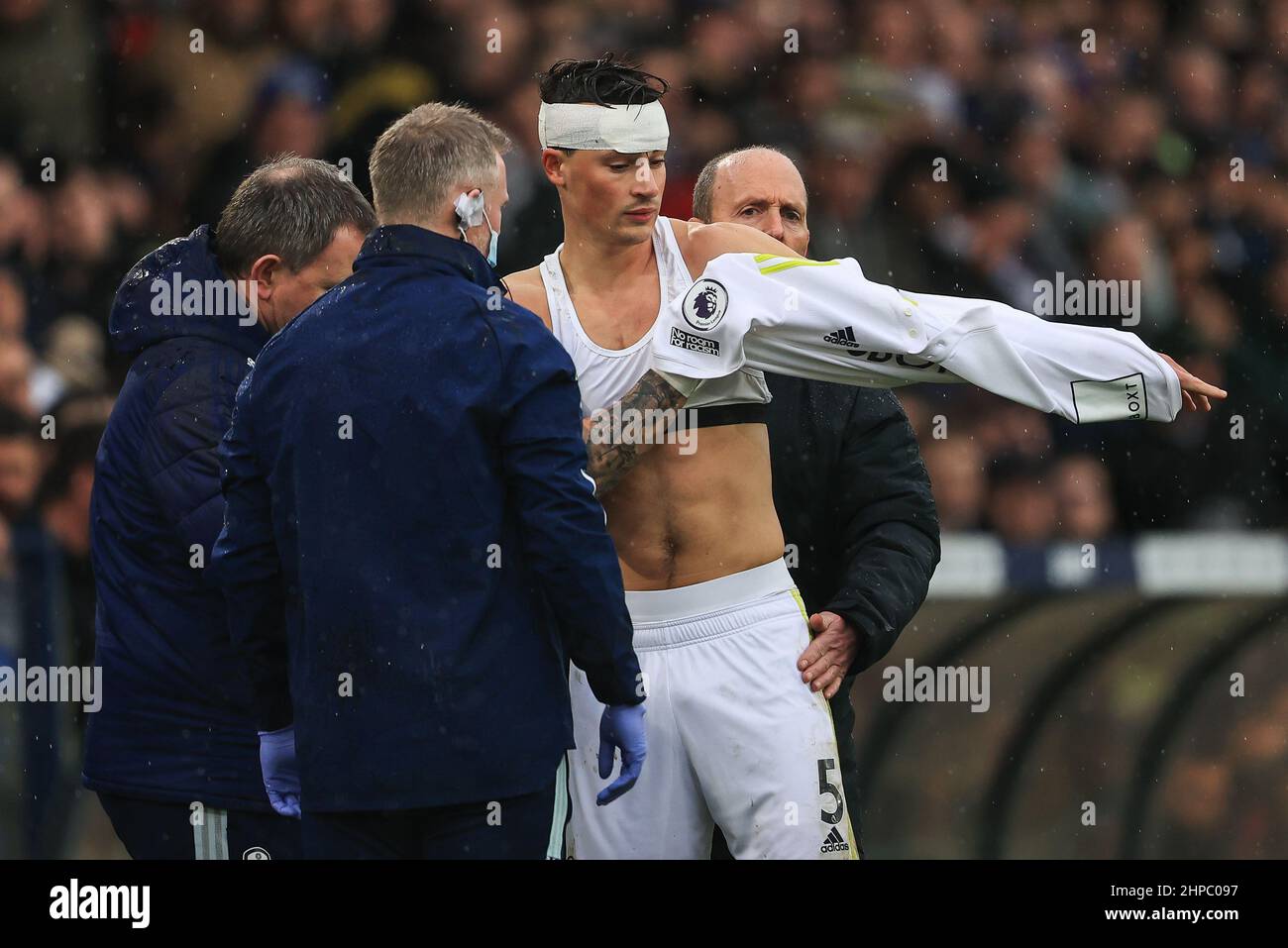 Robin Koch #5 of Leeds United replaces his shirt after a head injury ...