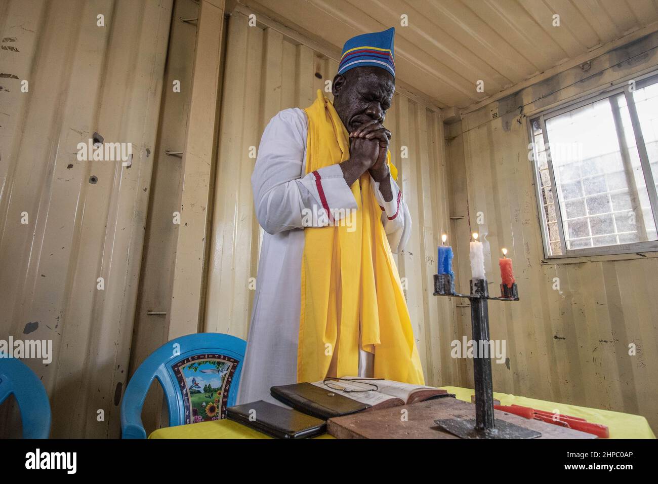 NAIROBI, KENYA-MARCH 21: A pastor prays during a Sunday Church service ...