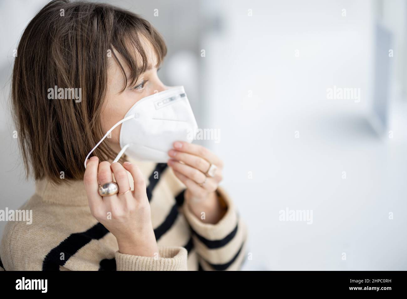 Woman taking off mask hi-res stock photography and images - Alamy