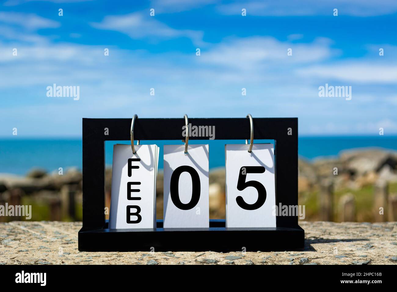 Feb 05 calendar date text on wooden frame with blurred background of ...